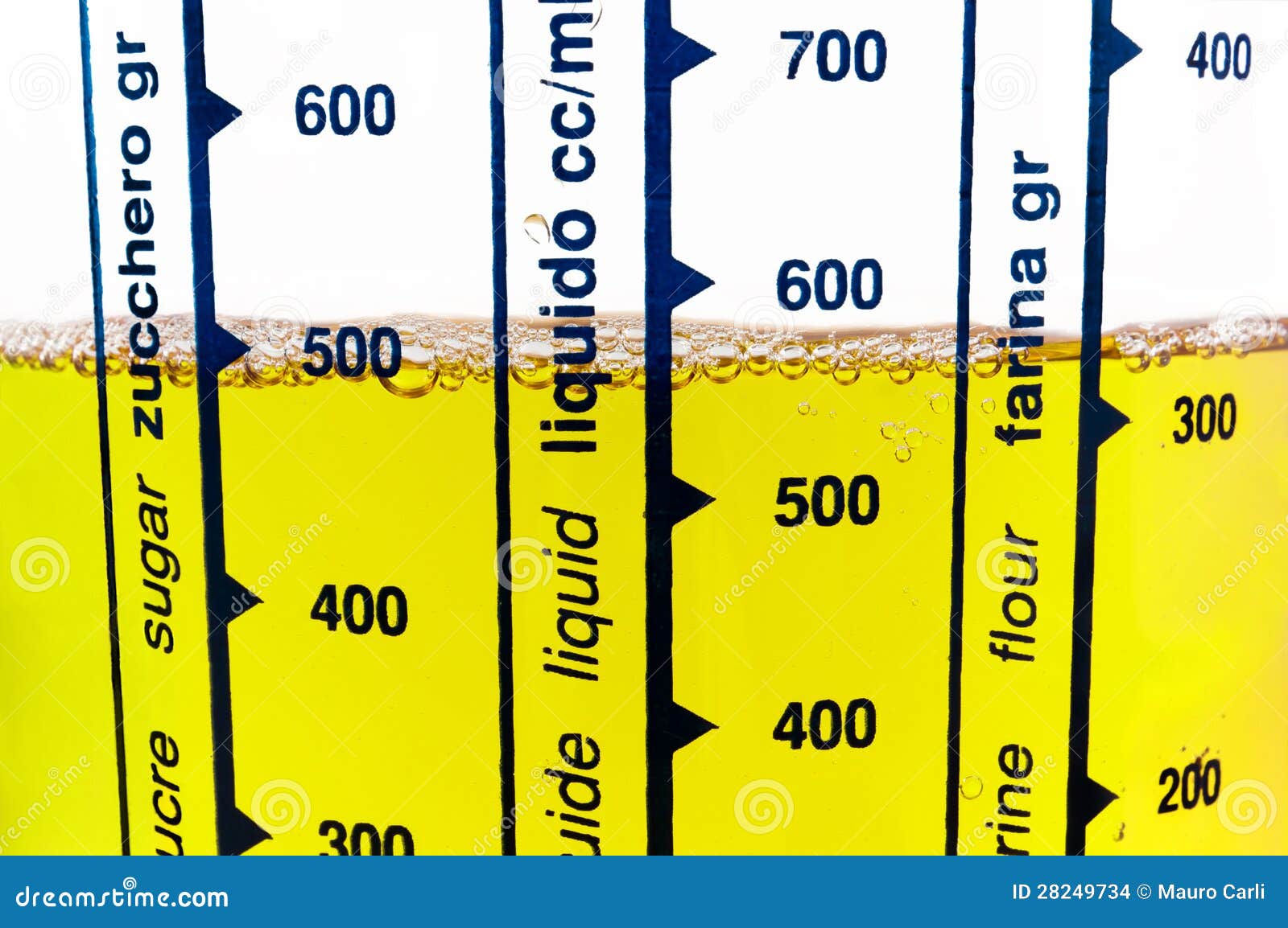Closeup on a Full Measuring Jug Stock Photo - Image of liquid, full ...