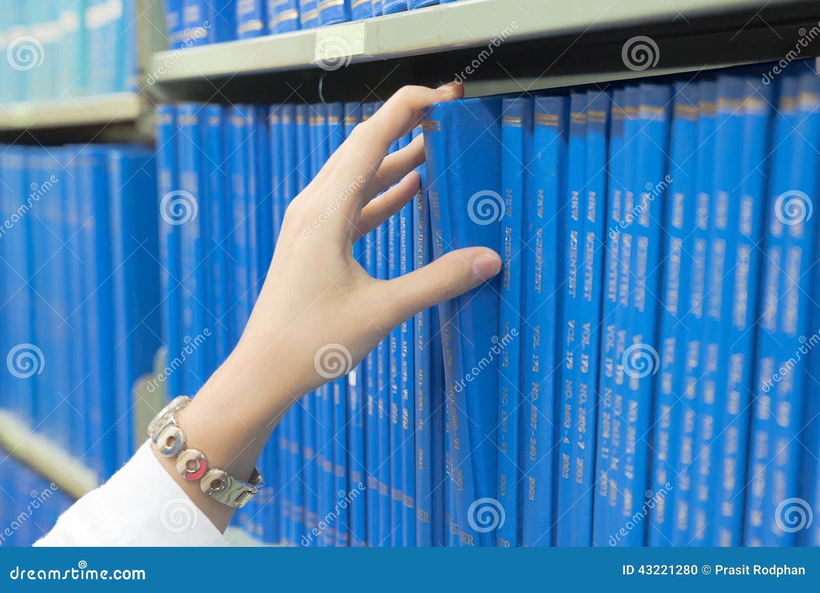 Closeup Girl Hand Selecting Book from a Bookshelf Stock Photo - Image ... Closeup Girl Hand Selecting Book from a Bookshelf Stock Photo - Image ...