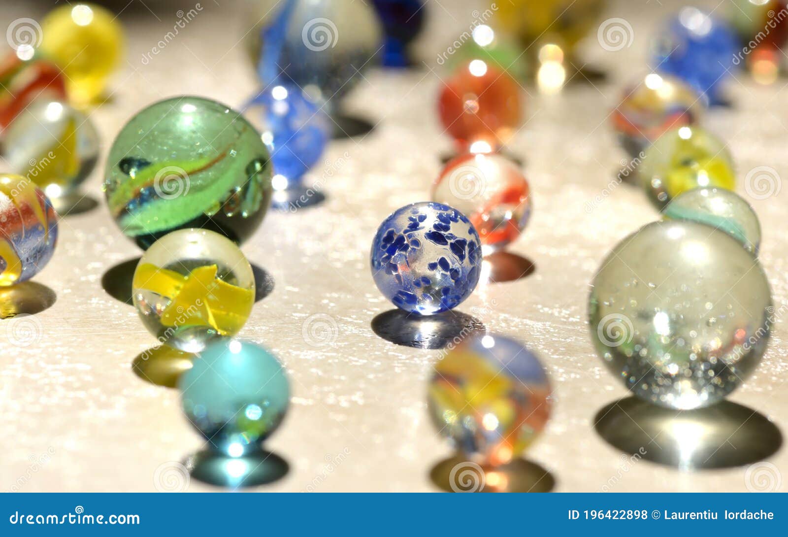 Closeup Glass marble balls stock photo. Image of backlit - 196422898