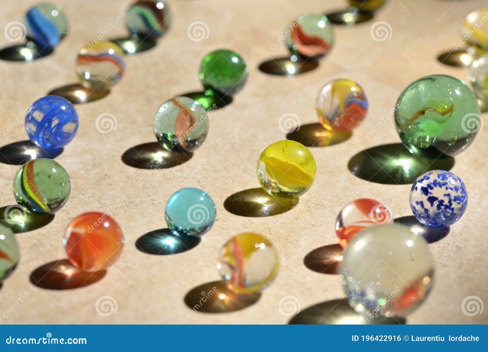 Closeup Glass marble balls stock photo. Image of backlit - 196422916