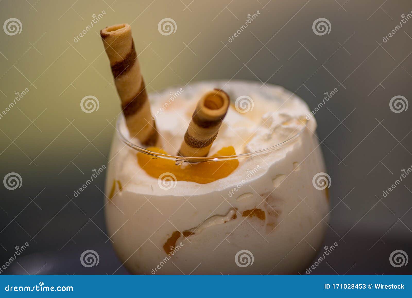 Closeup of a Glass of Milkshake Under the Lights with a Blurry ...