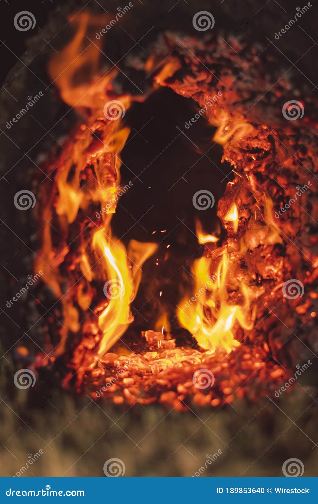 Closeup of Glowing Log Embers and Flames Creating a Fiery Abstract ...