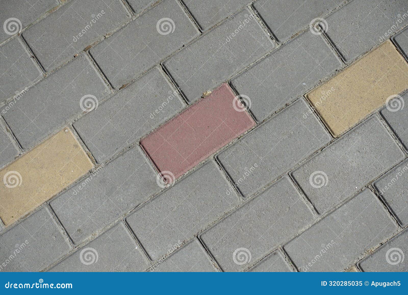 Closeup of Gray, Pink and Yellow Concrete Pavement with Stretcher Bond ...