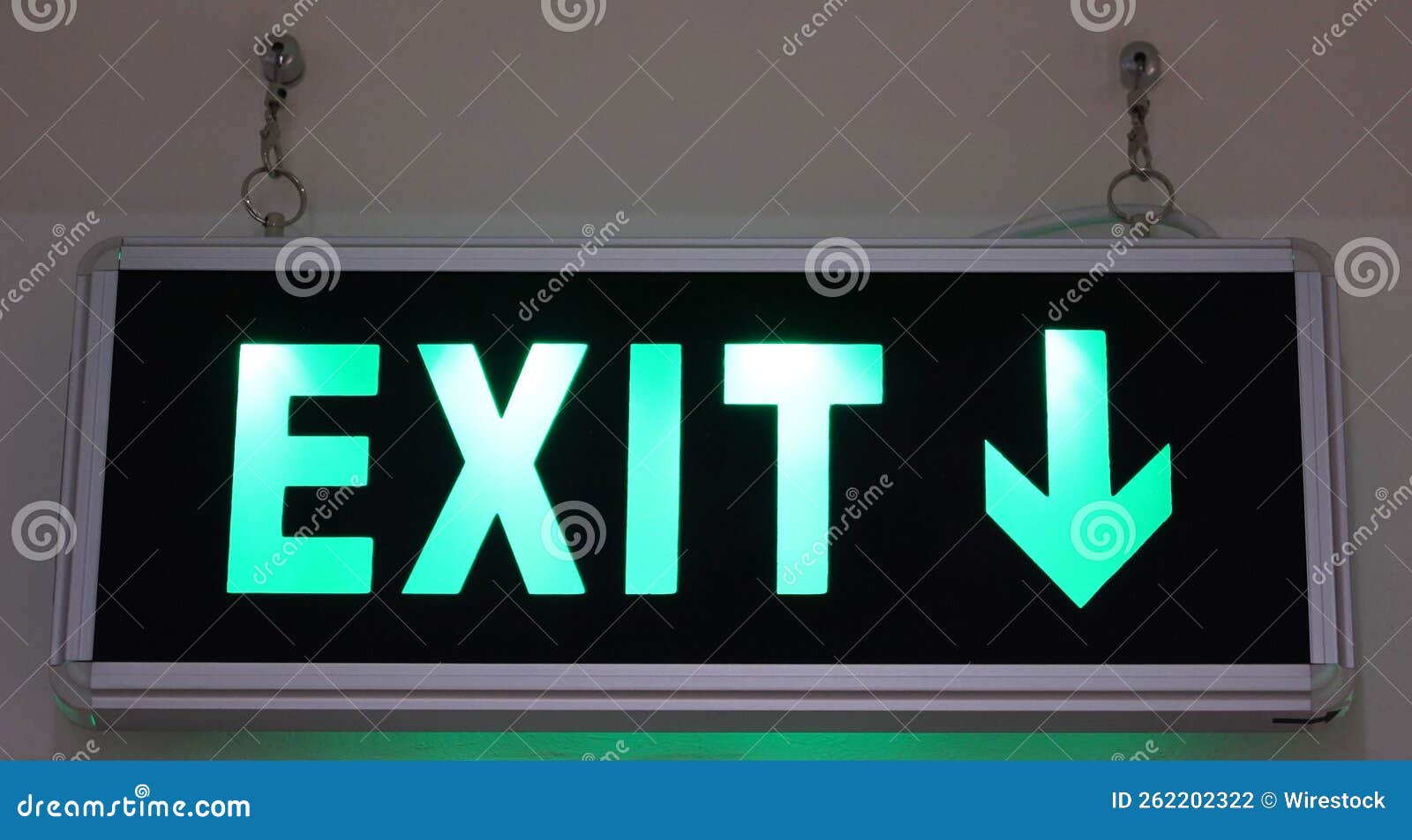 Closeup of a Green EXIT Sign with an Arrow Pointing Down Stock Photo ...