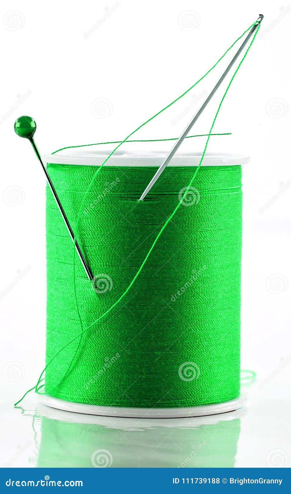 Bobbin Of Green Sewing Thread With Pin Stock Photo - Image of ...