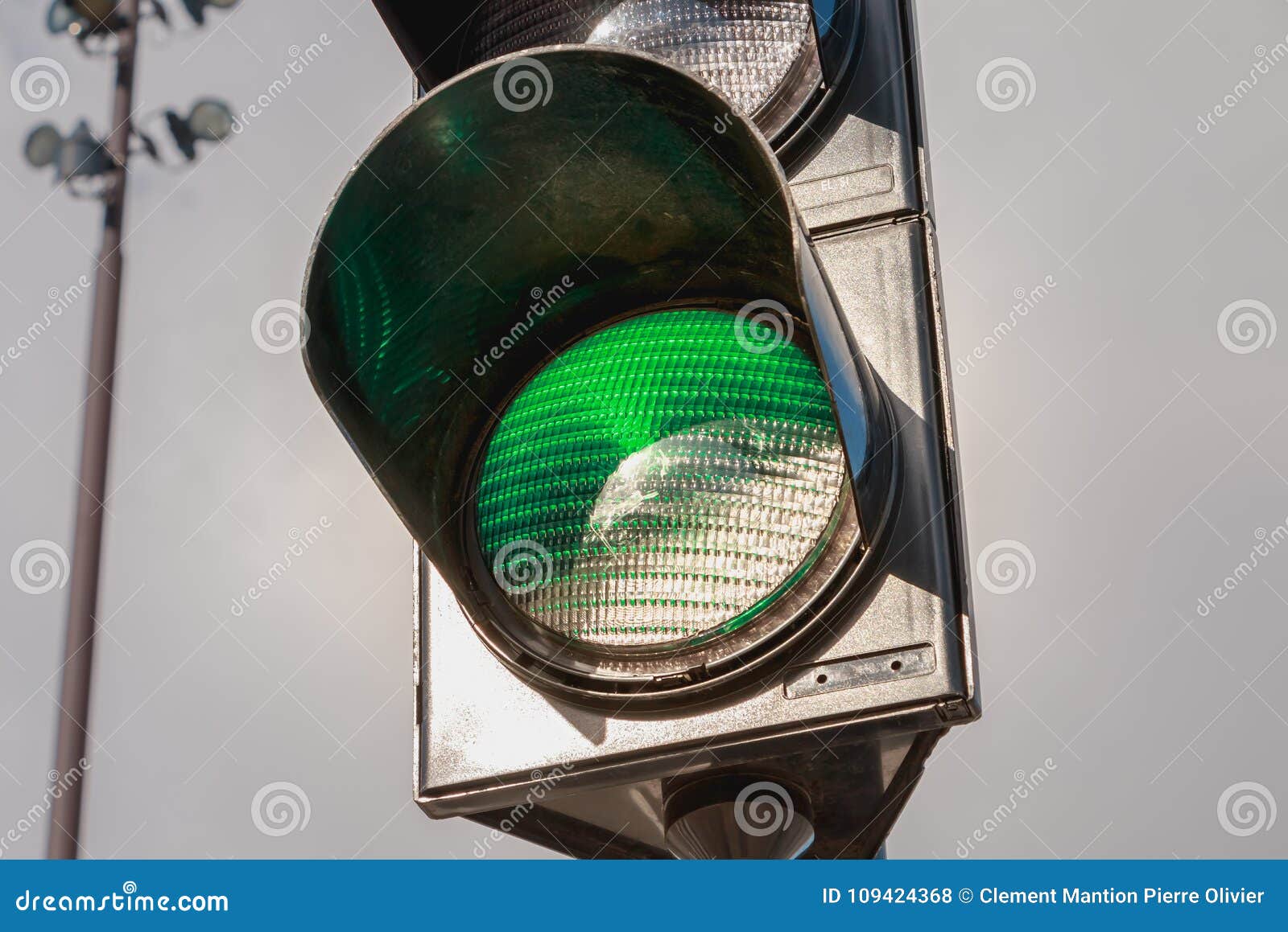 Green Traffic Light on Gray Sky Background Stock Photo - Image of ...