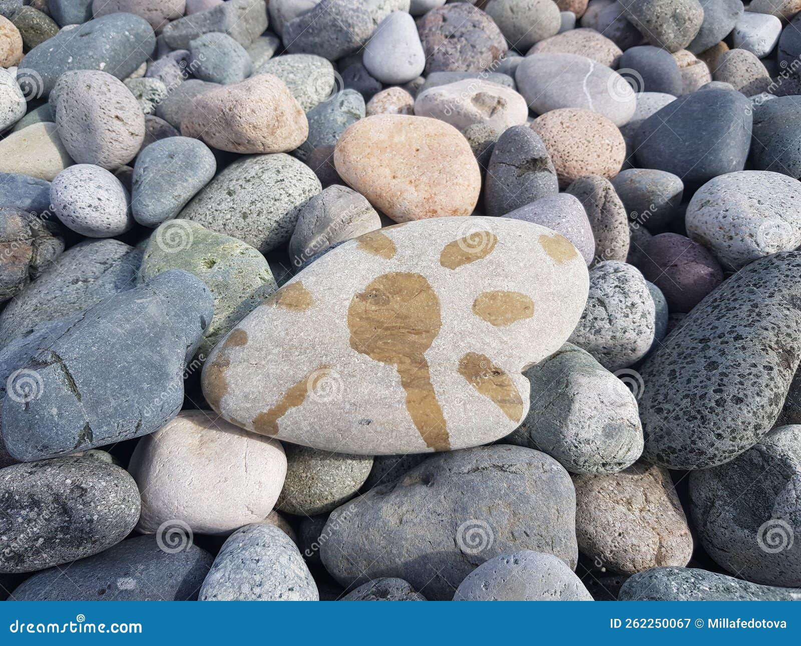 Closeup of Grey Pebbles on a Beach with Painting of Sun Stock Image ...