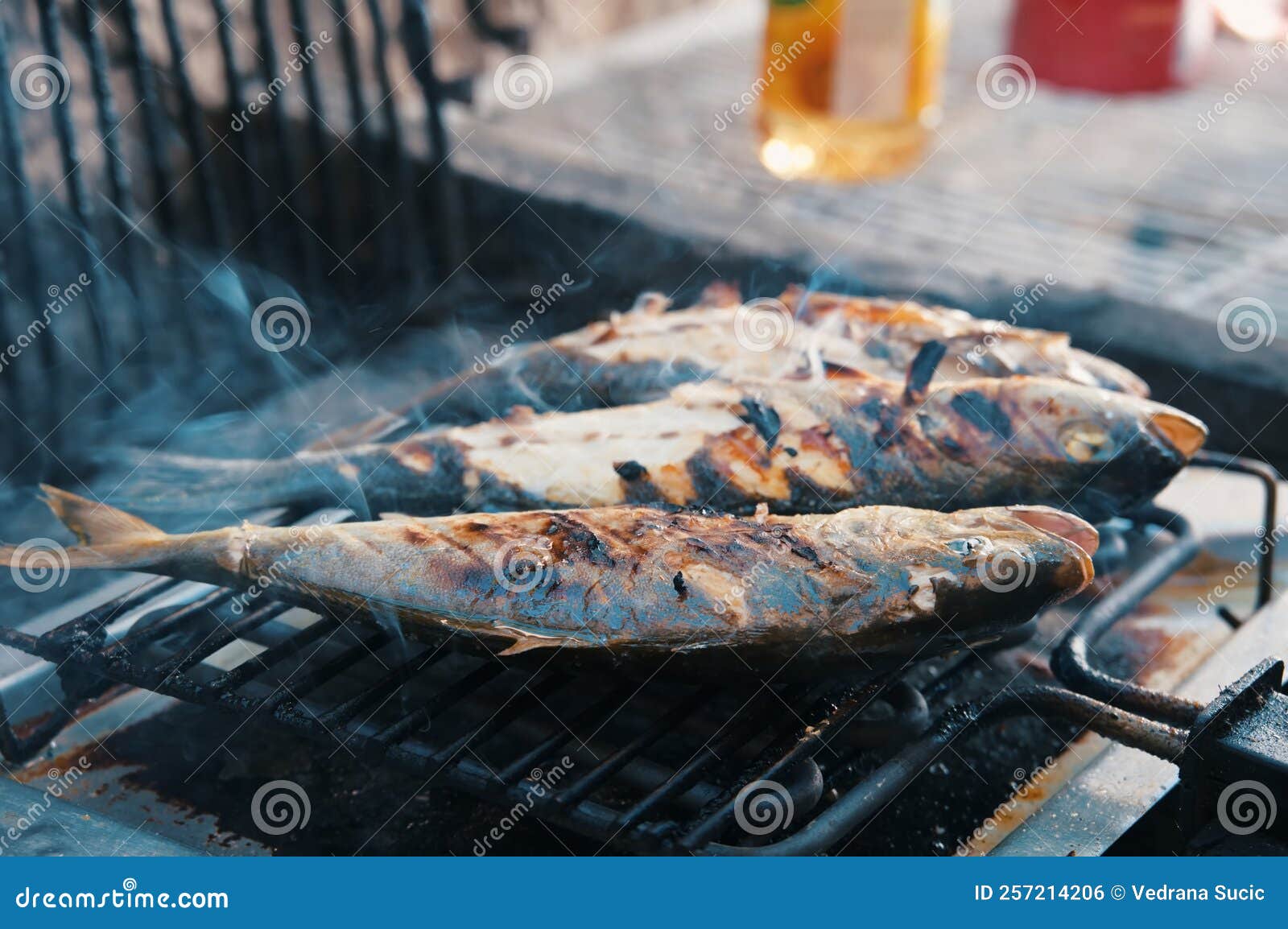 Grilled fish on gridiron stock photo. Image of burning - 257214206