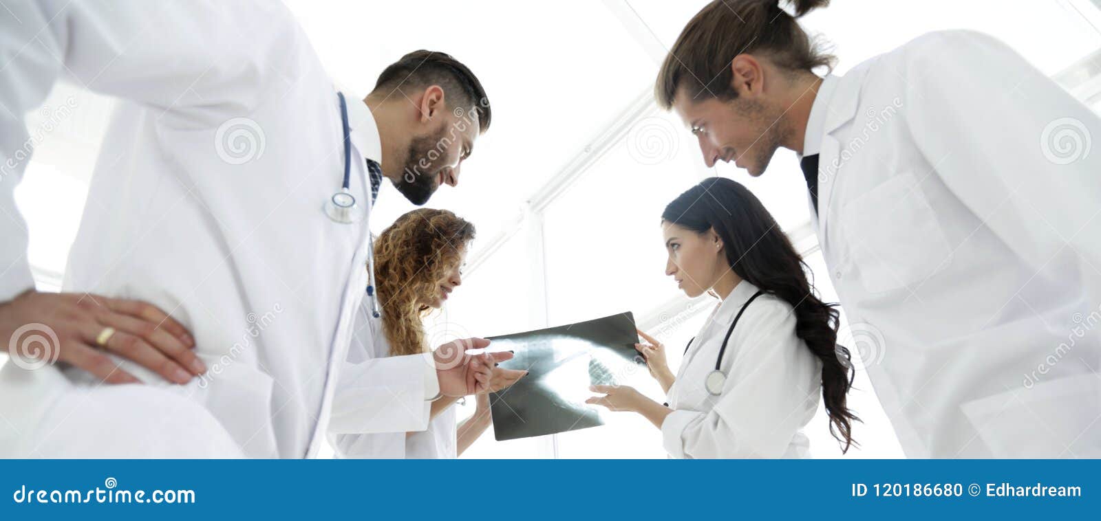 Group of Doctors Discussing an X-ray Stock Photo - Image of hospital ...
