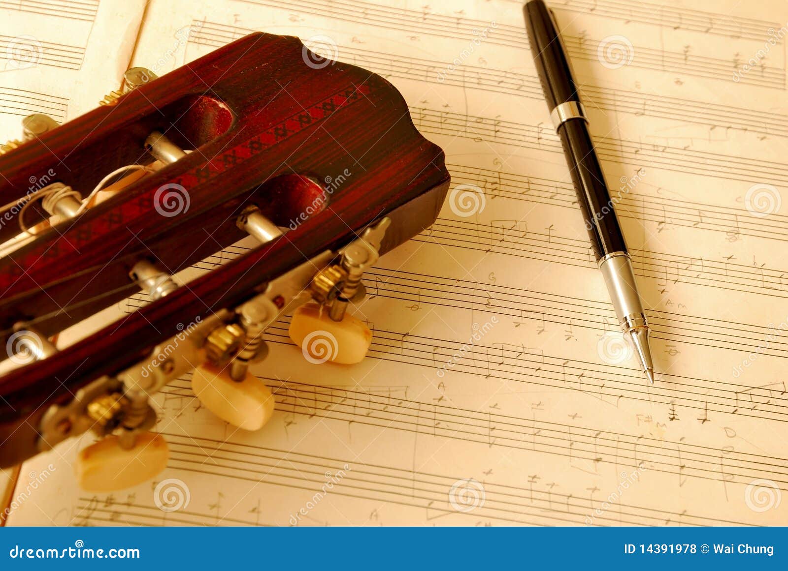 Closeup of Guitar with Pen on Music Manuscript Stock Photo - Image of ...