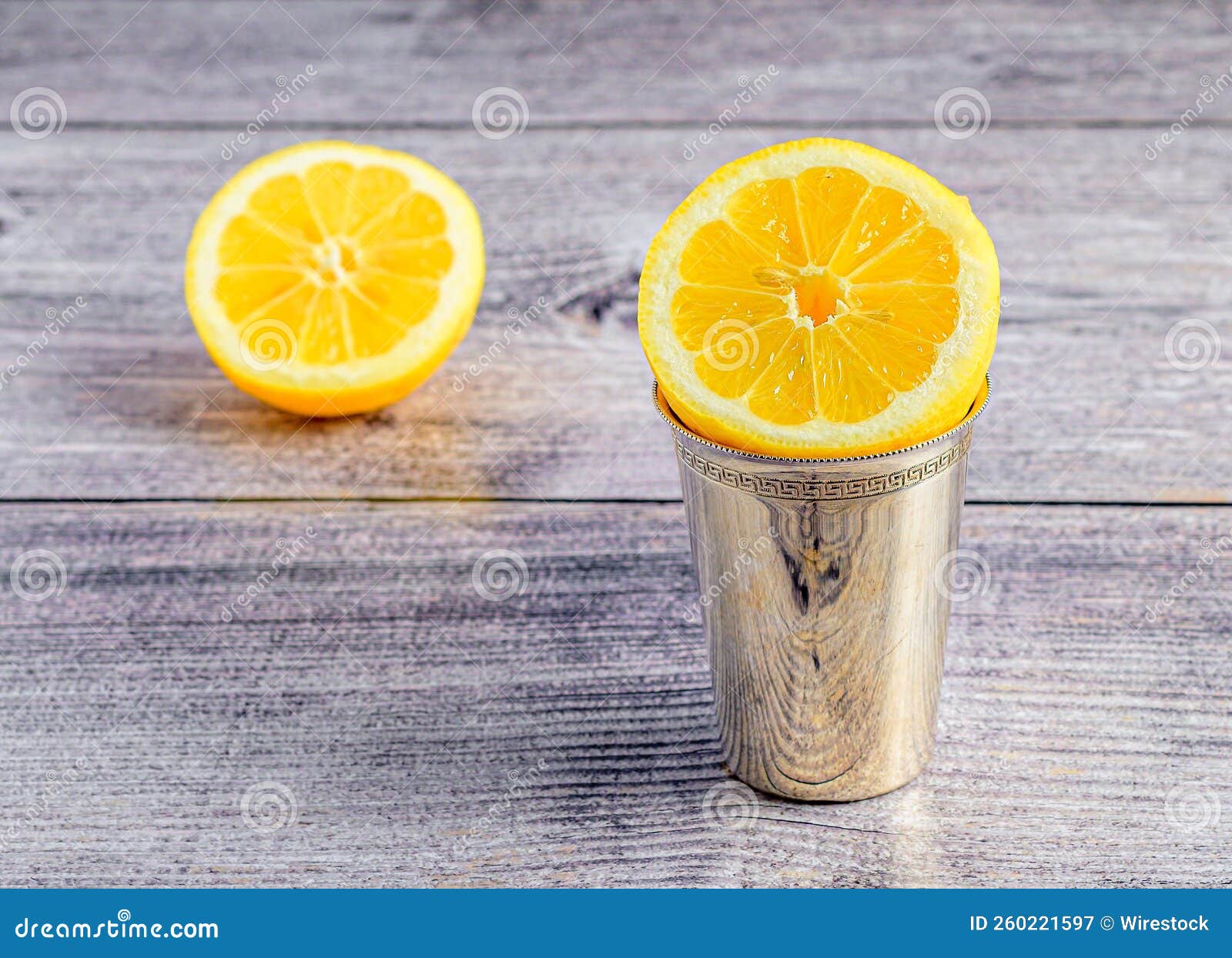 Closeup of Half a Lemon Split on Top of a Glass Stock Image - Image of ...