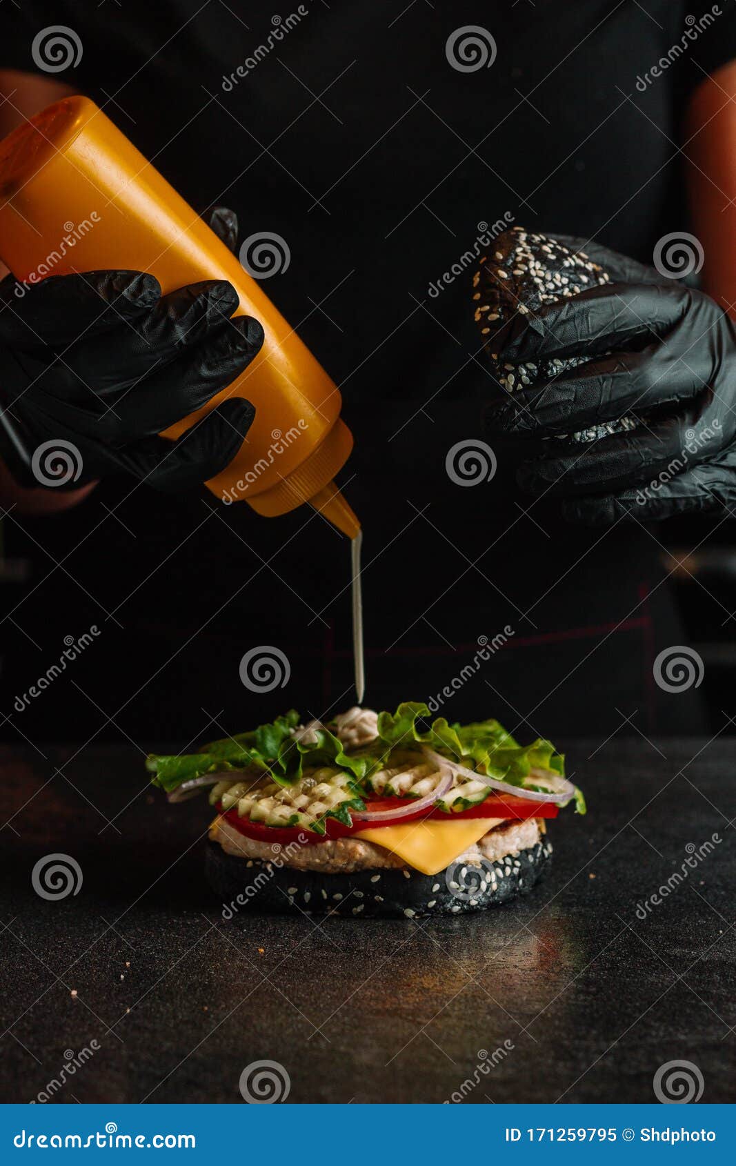A Closeup of a Hamburger Cooking Process. Chef on Kitchen Table Making ...