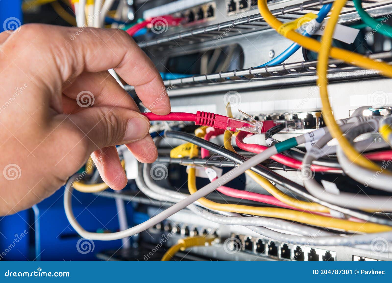 Hand of Engineer Plugging in Ethernet Cable into Server Switch P Stock ...