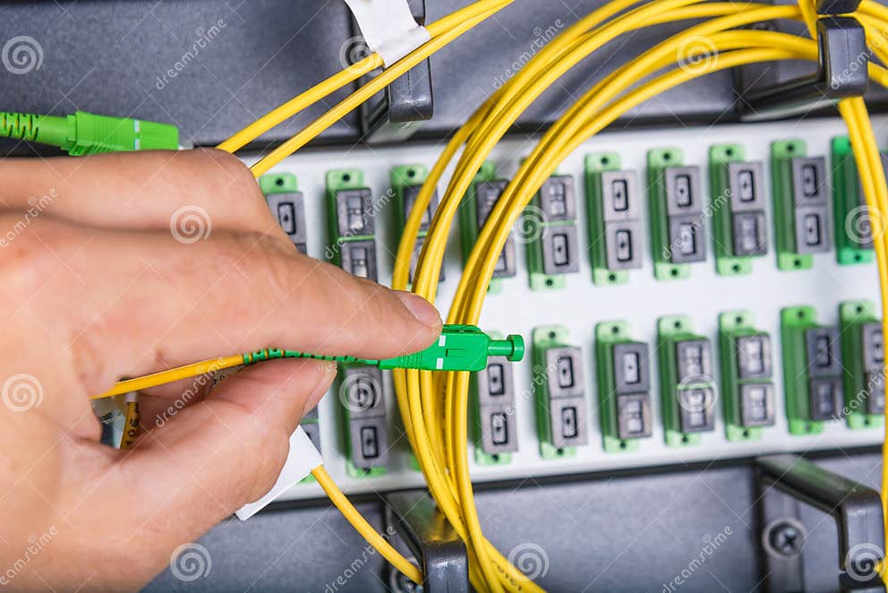 Hand of Engineer Plugging in Ethernet Cable into Server Switch P Stock ...