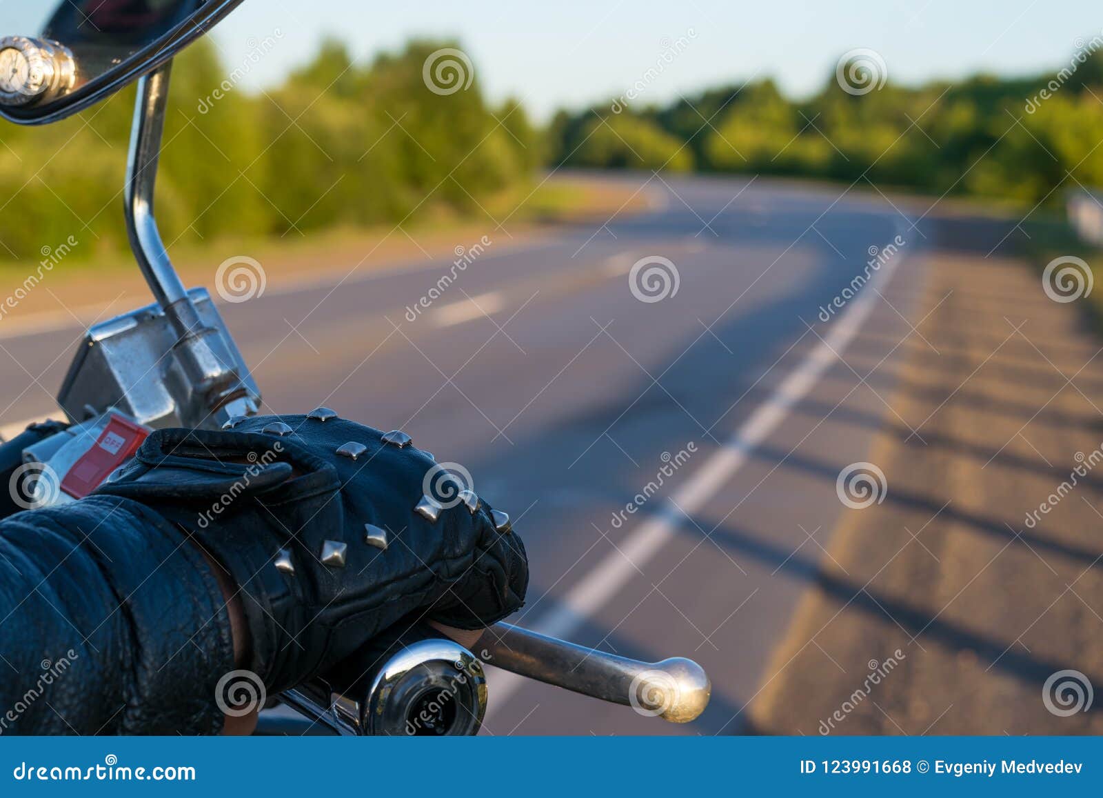 The Hand of the Biker on the Control Handle of the Motorcycle and the ...