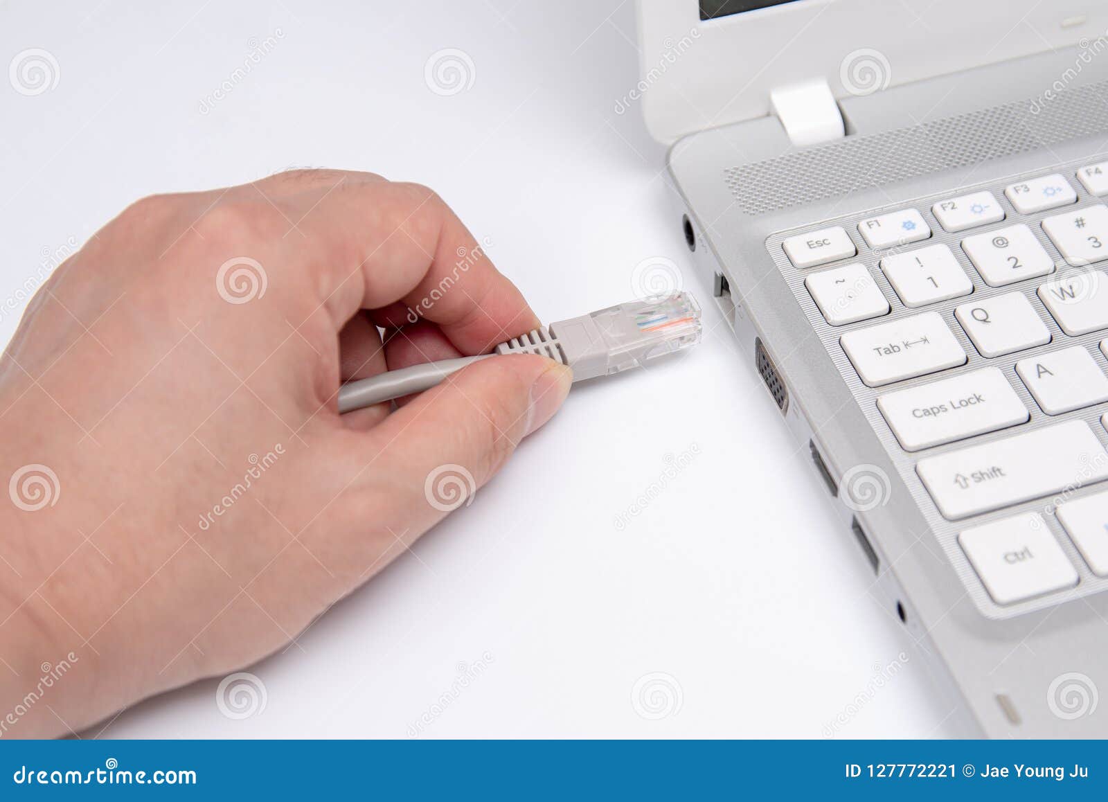 Closeup Hand Connection Cable Network Connection To a Lan Port of a ...