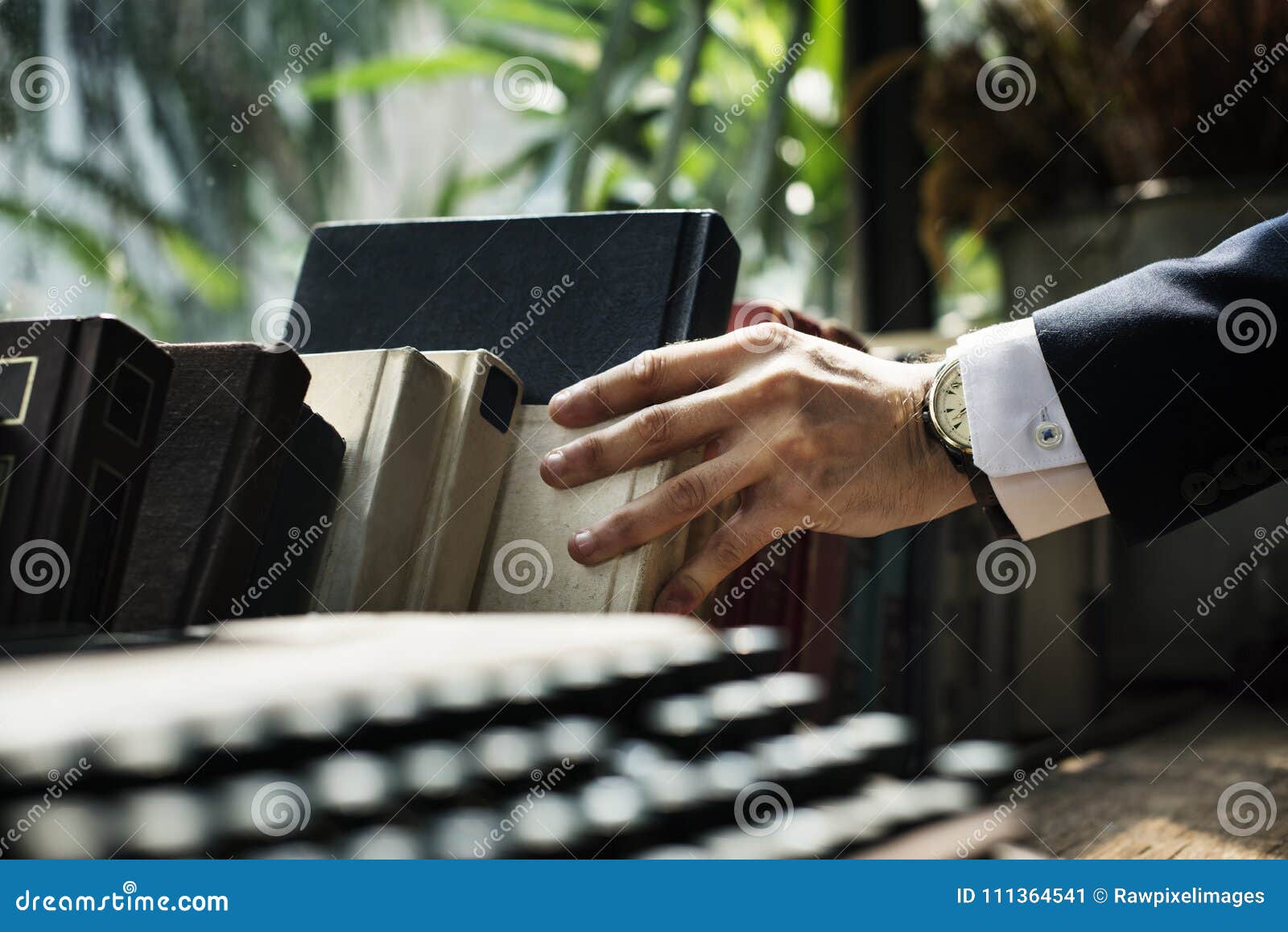 Closeup of Hand Getting a Book Stock Image - Image of classy, sleeve ...
