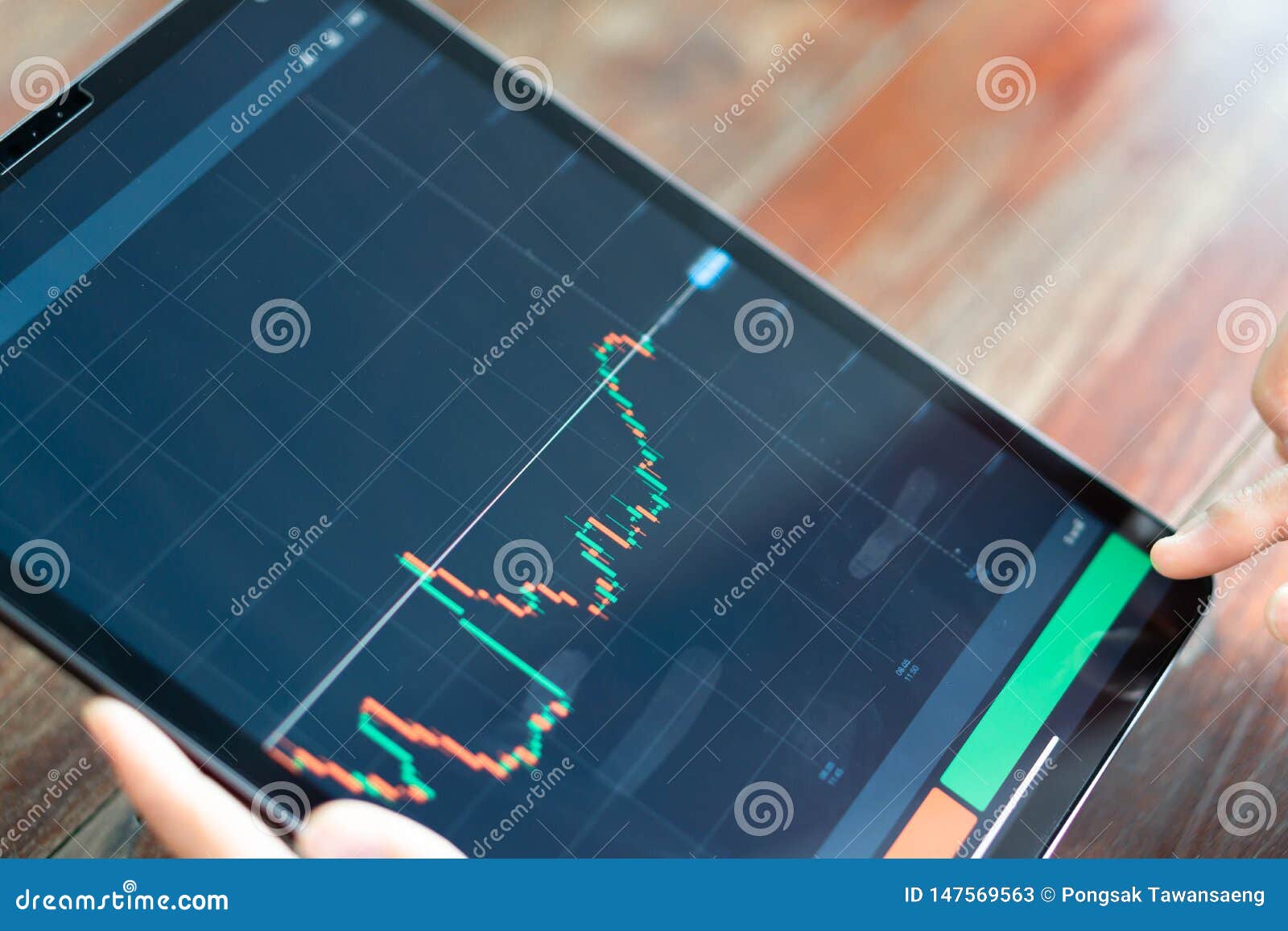 Closeup Hand Holding Digital Tablet Computer with Graph of Binary ...