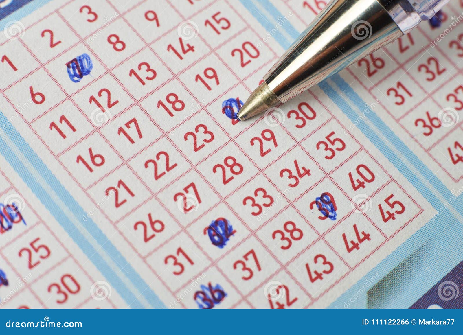 Closeup of Hand Marking Number on Lottery Ticket with Pen. Stock Photo ...