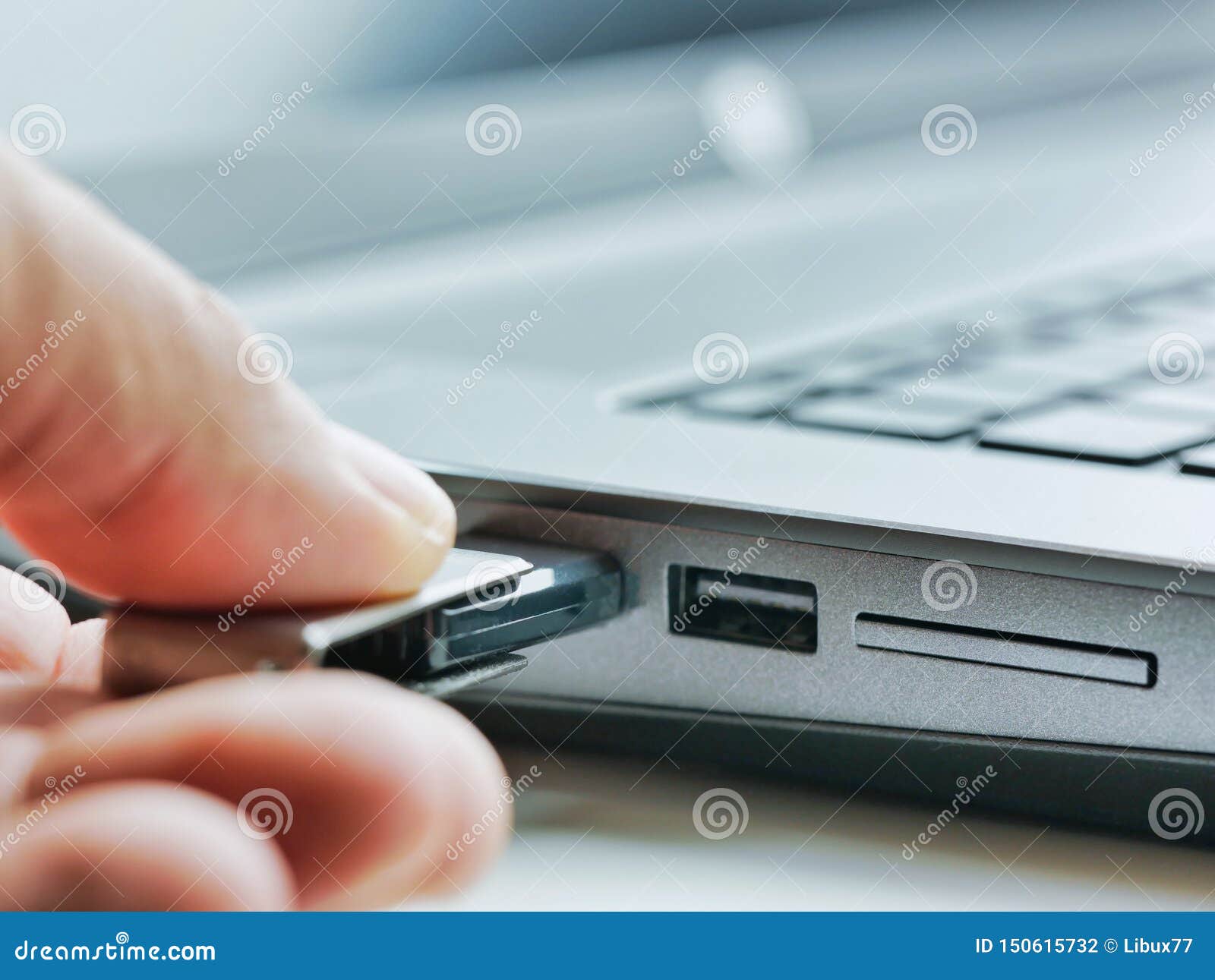 Closeup Hand Plugging in Usb Key or Driver into Laptop or Notebook ...