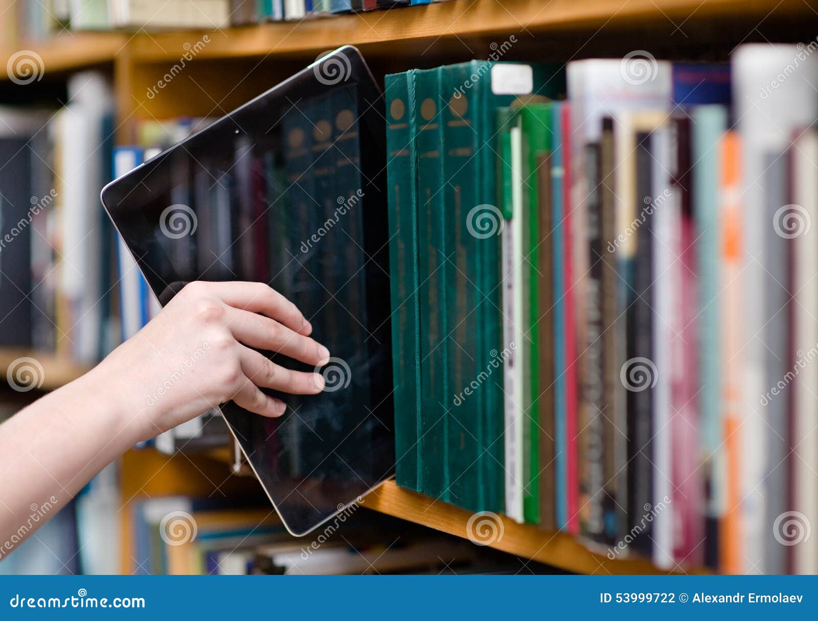 Closeup Hand Putting a Tablet Pc in the Shelves in the Library Stock ...