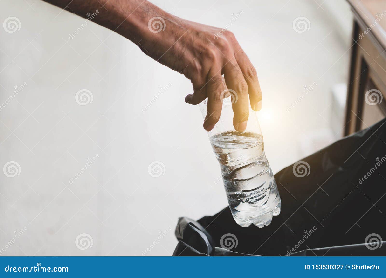 Closeup of Hand Throwing Garbage into Black Bag Bin. Ecology and ...