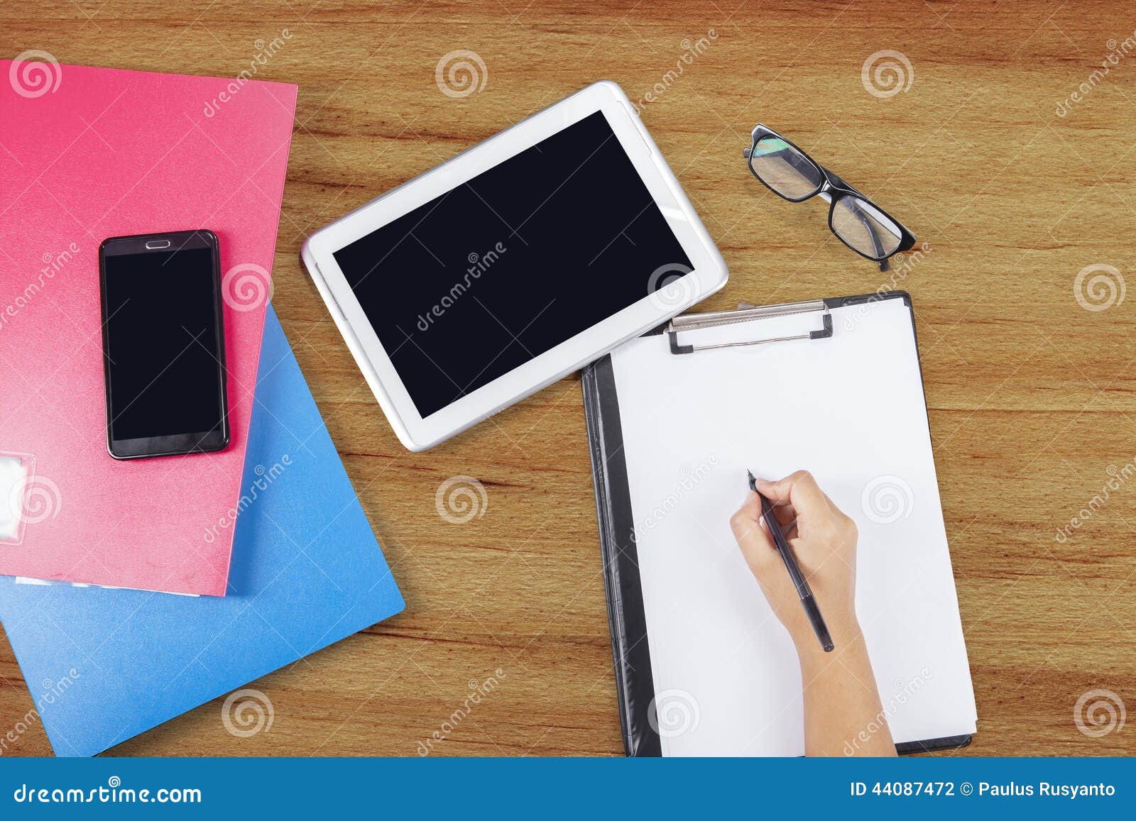 Closeup of Hand Writes on Clipboard Stock Photo - Image of computer ...