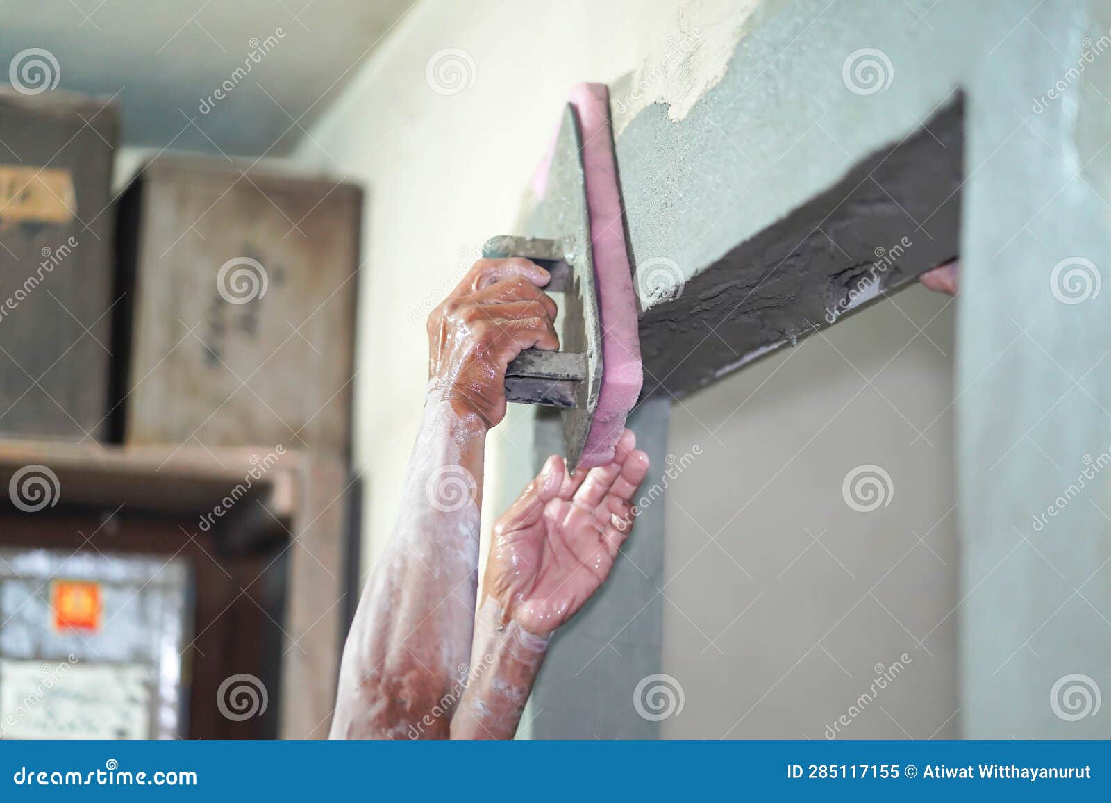 Closeup Hands of Builder Holding Mortar Pan and Sponge Plastering Walls ...