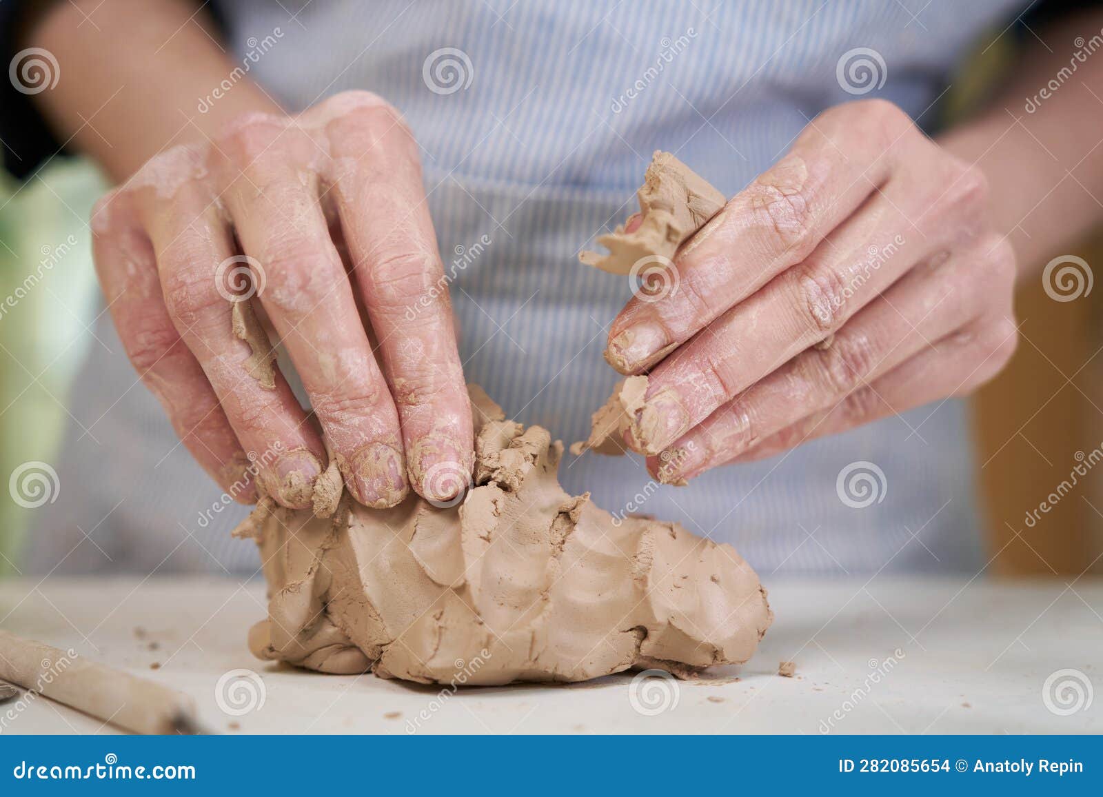 Closeup Hands of Ceramic Artist Wedging Clay in Art Studio Stock Photo ...