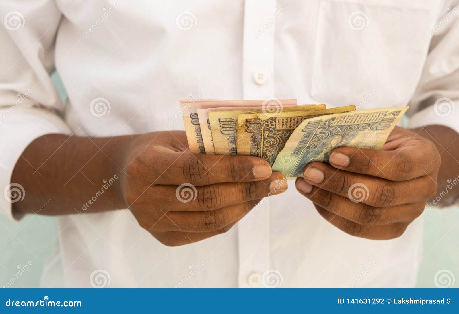 Man Is Counting Indian 10 Rupee Currency Notes. Picture Of Calculator ...