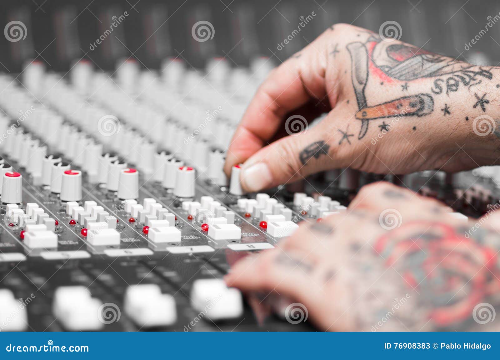 Closeup of Hands Covered with Tattoos Working on Mixer Console ...