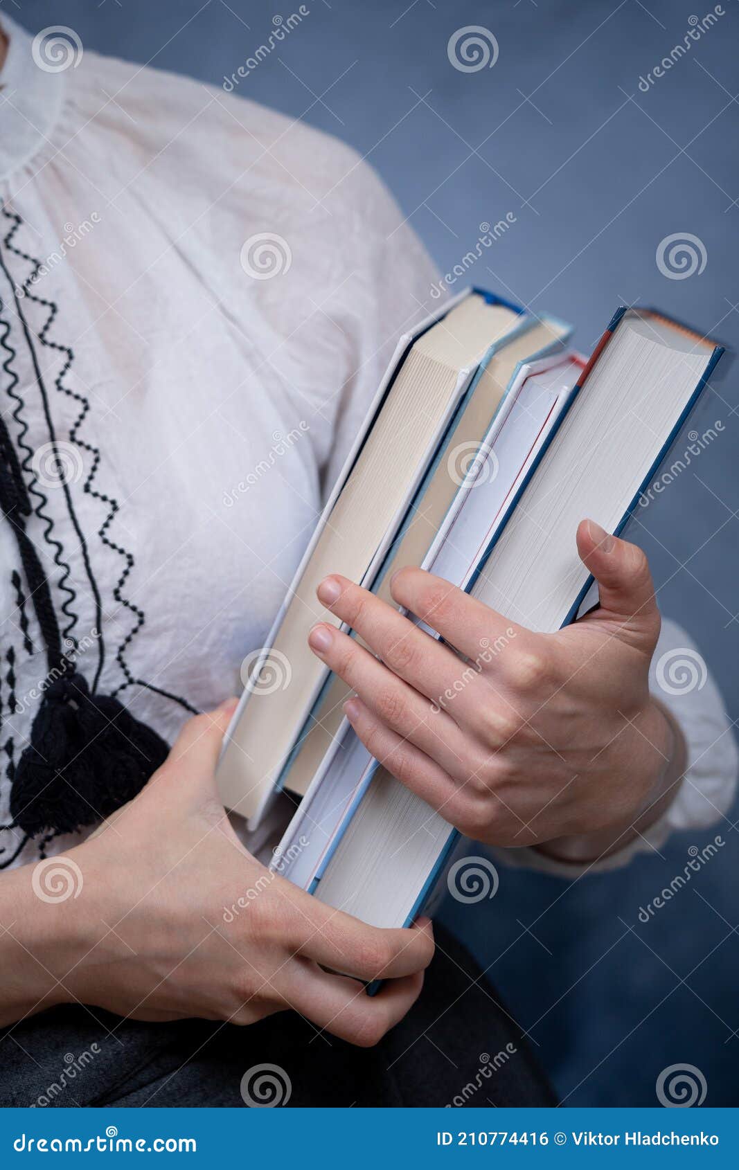 Closeup of Hands Holding a Stack of Books. Concept of Education and ...