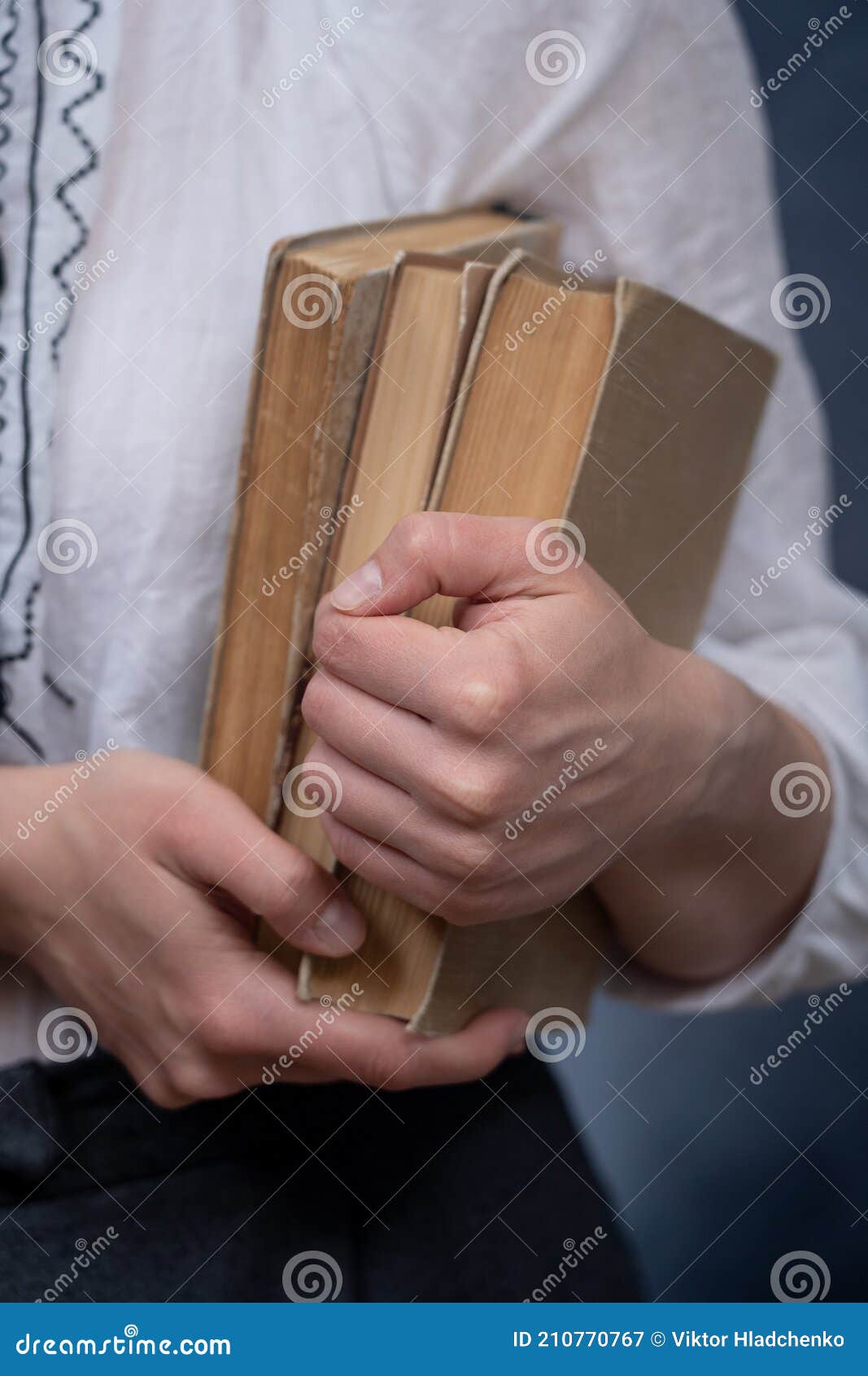 Closeup of Hands Holding a Stack of Vintage Old Books. Concept of Self ...