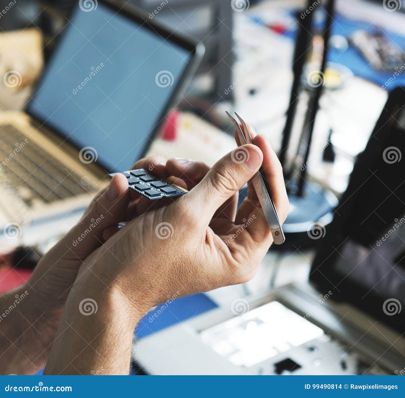 Closeup of Hands Holding Tweezer with Computer Processor Chips Stock ...
