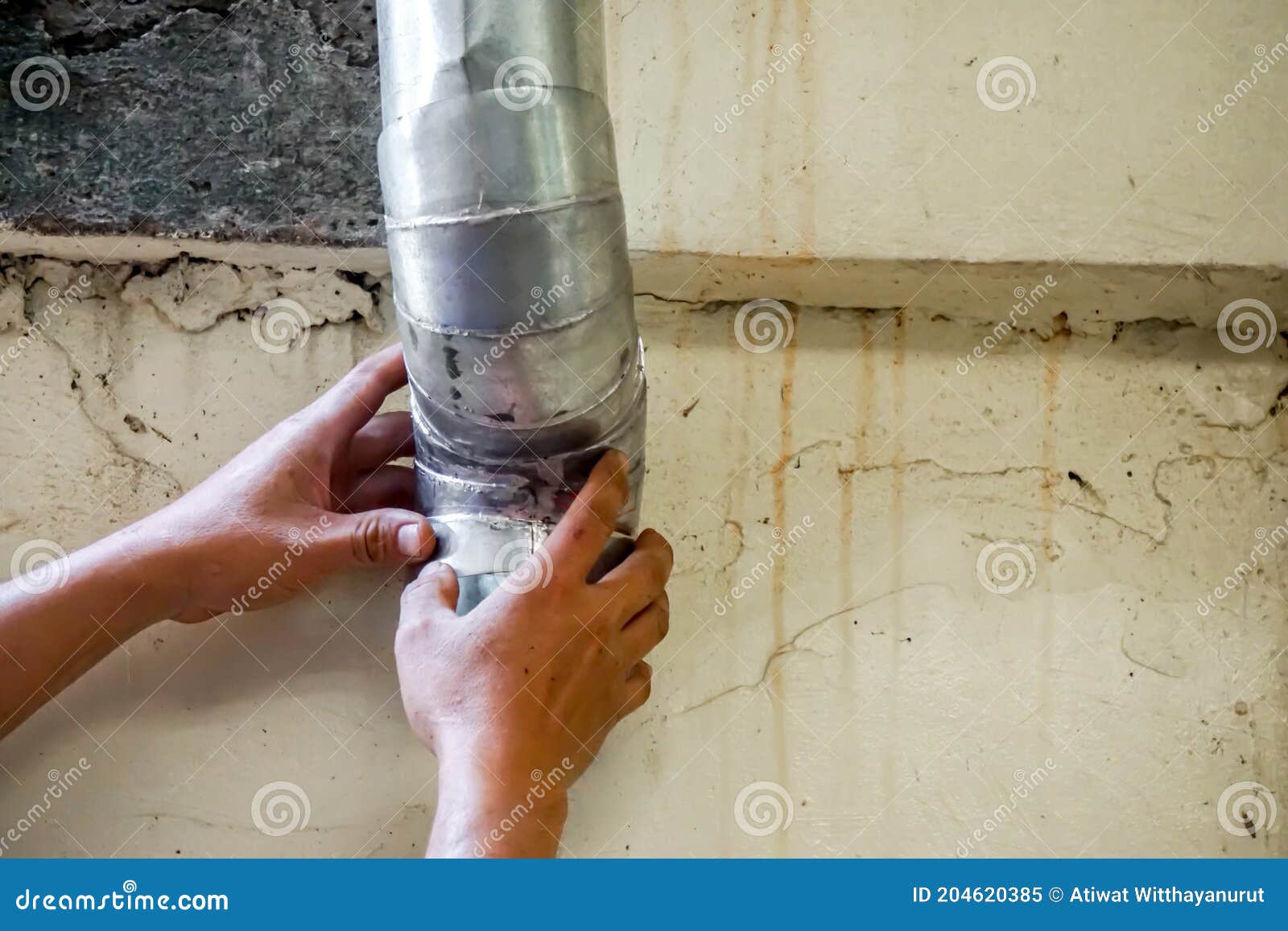 Closeup Hands of Laborer Holding Tools and Galvanized Pipe To Repair at ...