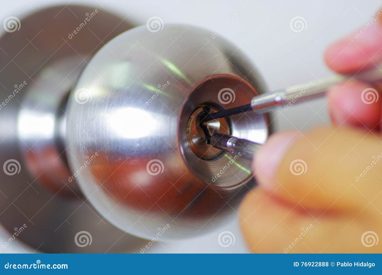 Closeup Hands of Locksmith Using Metal Pick Tools To Open Locked Door ...