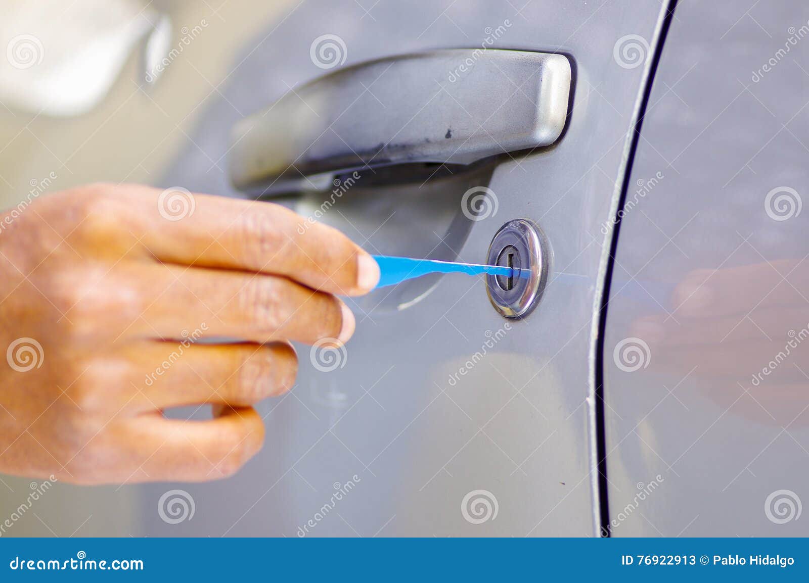 Closeup Hands of Locksmith Using Pick Tools To Open Locked Car Door ...