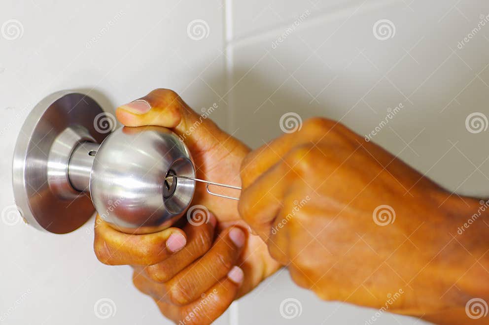 Closeup Hands of Locksmith Using Pick Tools To Open Locked Door Stock ...