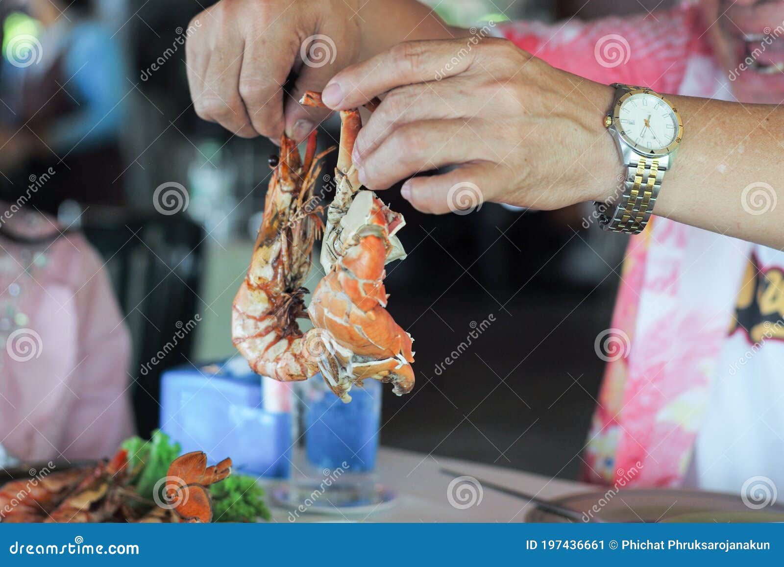 Closeup Hands of Man Holding the Steamed Shrimp and Clap Stock Image ...