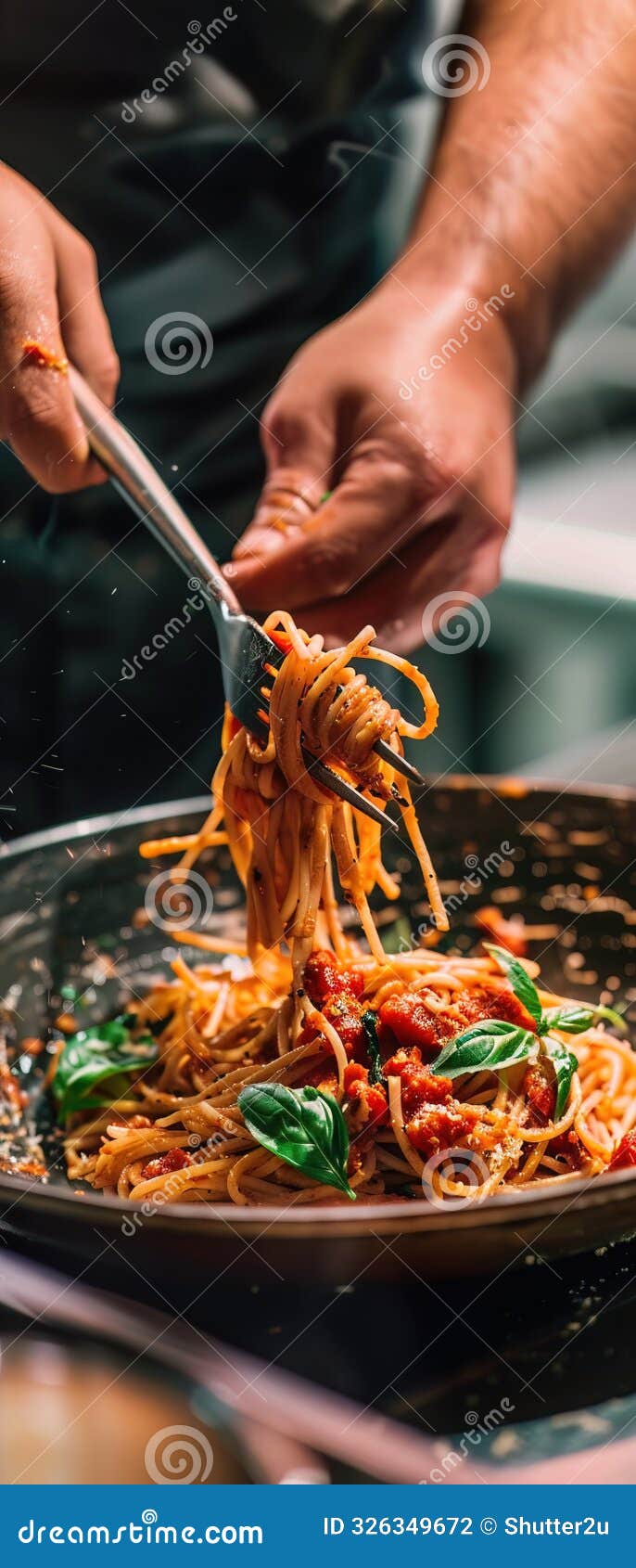 Closeup Of Hands Twisting A Pasta Fork Winding Spaghetti With A Rich ...