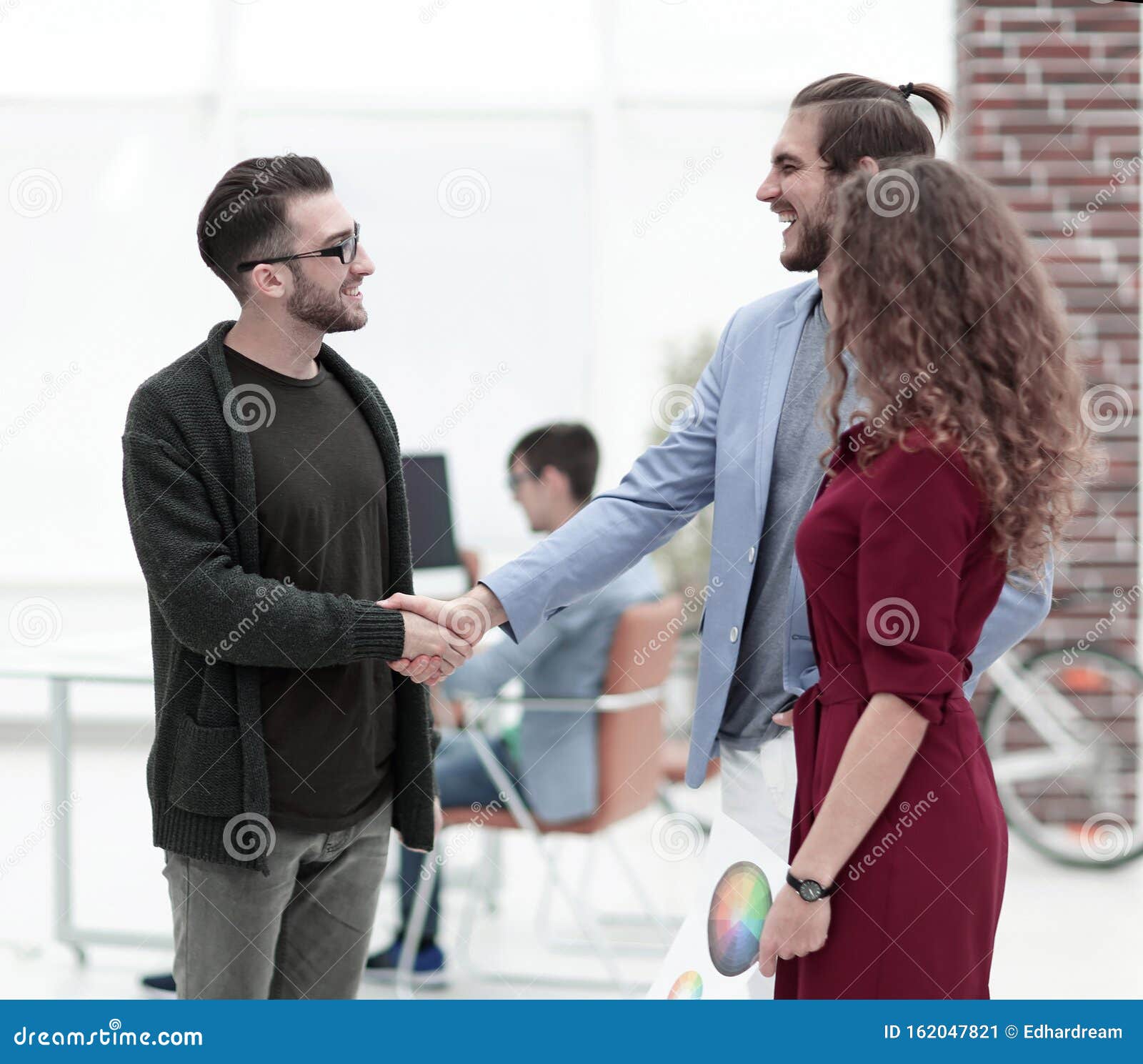 Closeup.the Handshake between the Designer and the Client Stock Image ...