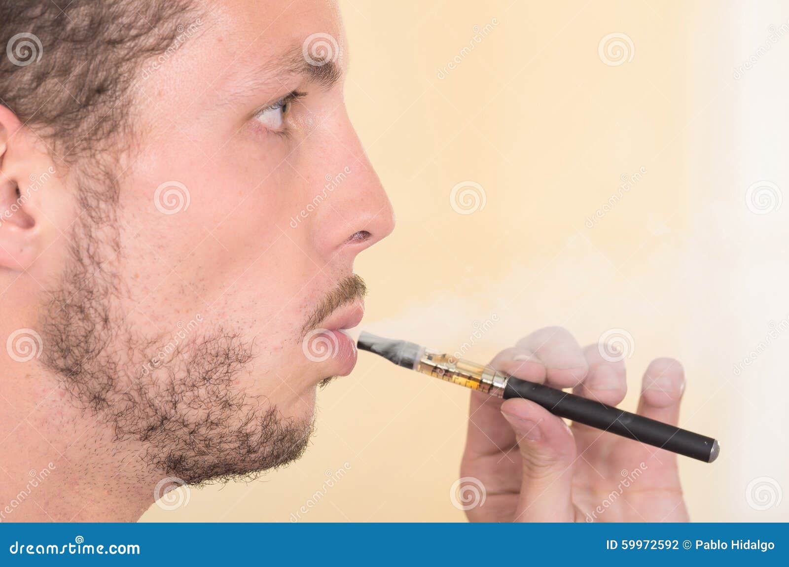 Closeup Headshot of Man Smoking on Electronic Stock Photo - Image of ...
