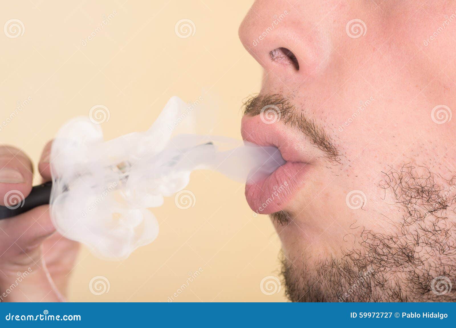 Closeup Headshot of Man Smoking on Electronic Stock Image - Image of ...