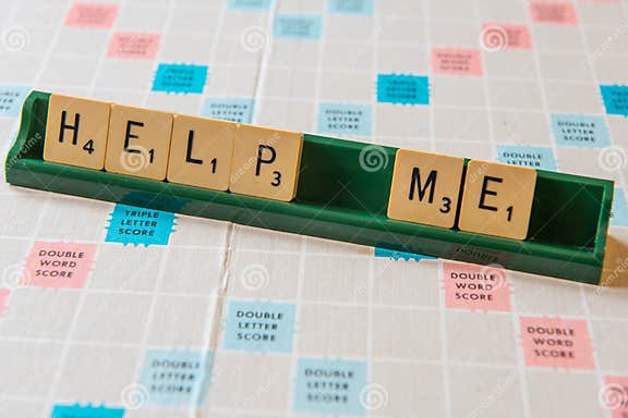 Closeup of Help Me Written on a Scrambling Board Under the Lights Stock ...