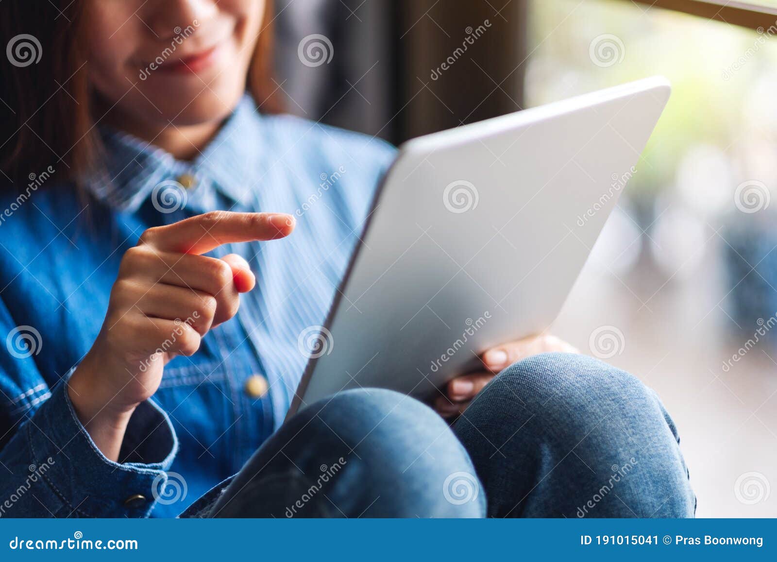 A Beautiful Young Woman Holding and Using Tablet Pc Stock Image - Image ...