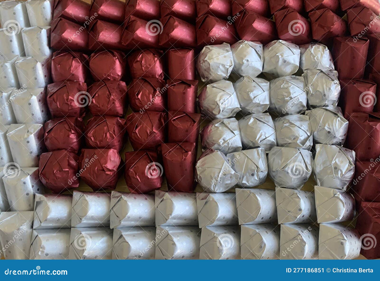 Closeup Image of a Box of Individually Wrapped Chocolates in Red and ...