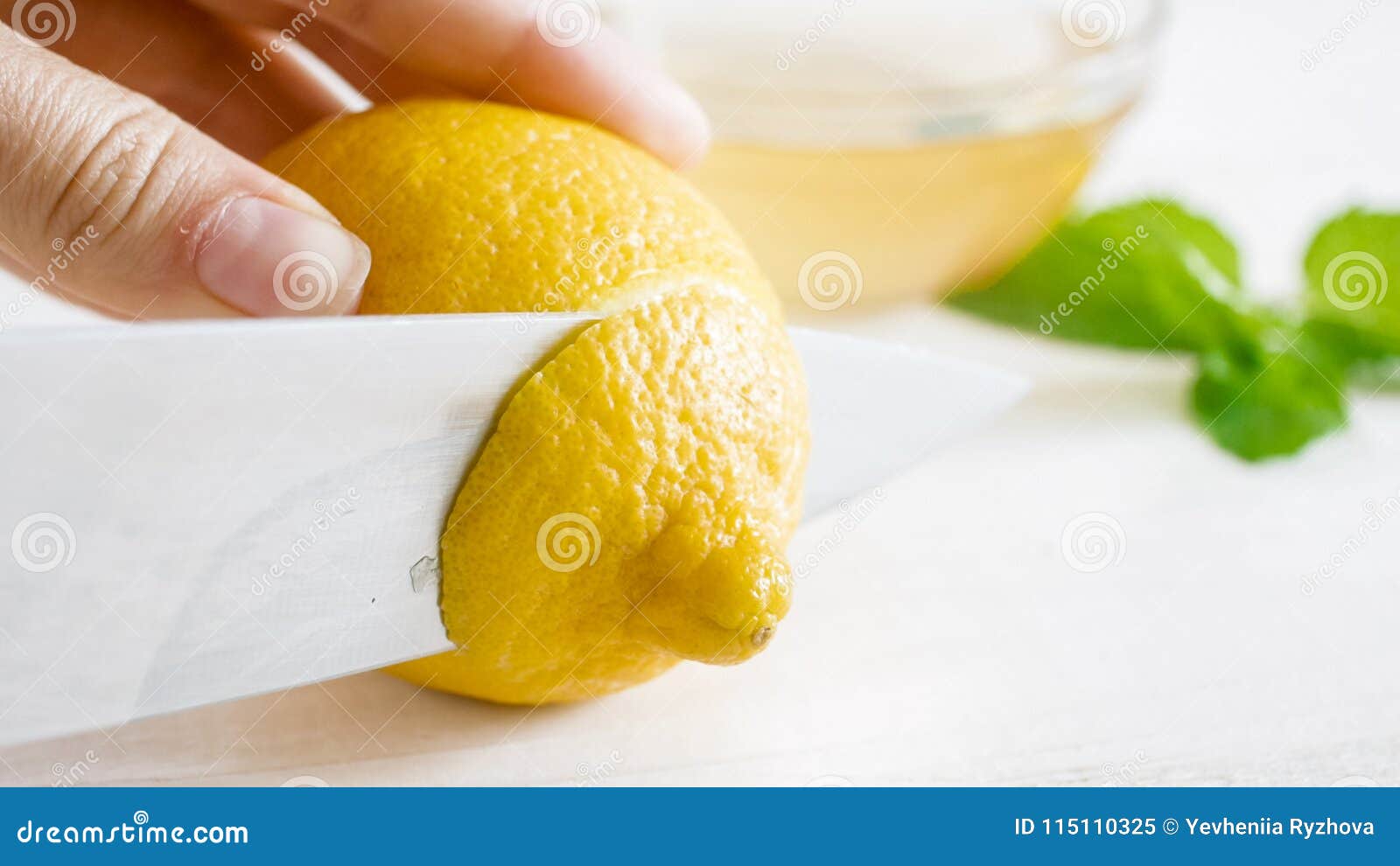 Closeup Image of Hand Cutting Fresh Lemon with Knife Stock Image ...