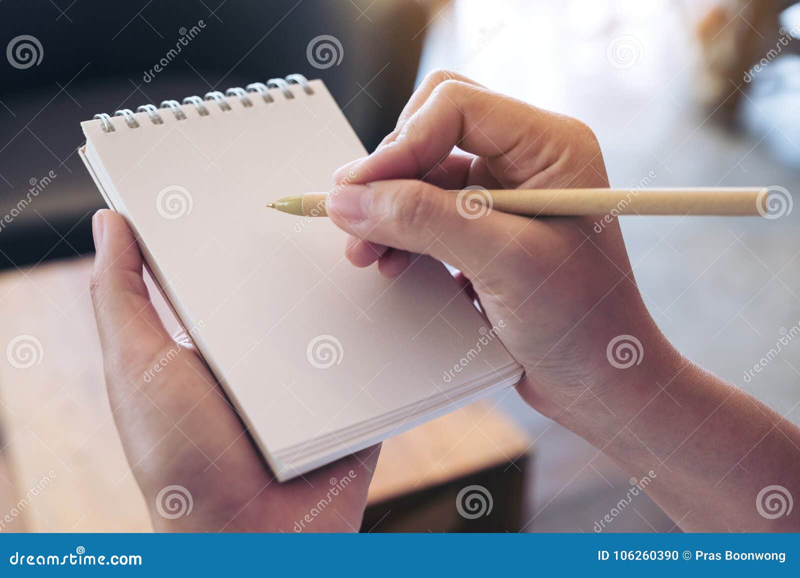 Closeup Image of a Hand Holding and Writing on a Blank White Notebook ...