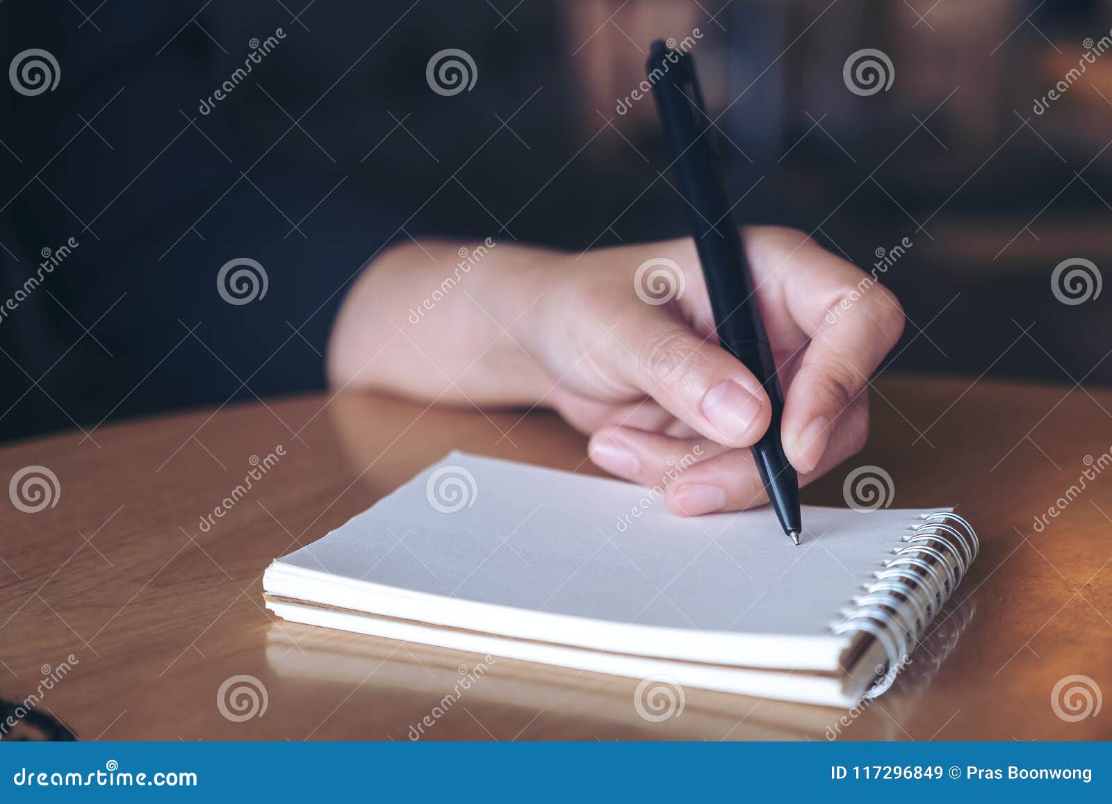 A Hand Writing Down on a White Blank Notebook on Table Stock Image ...