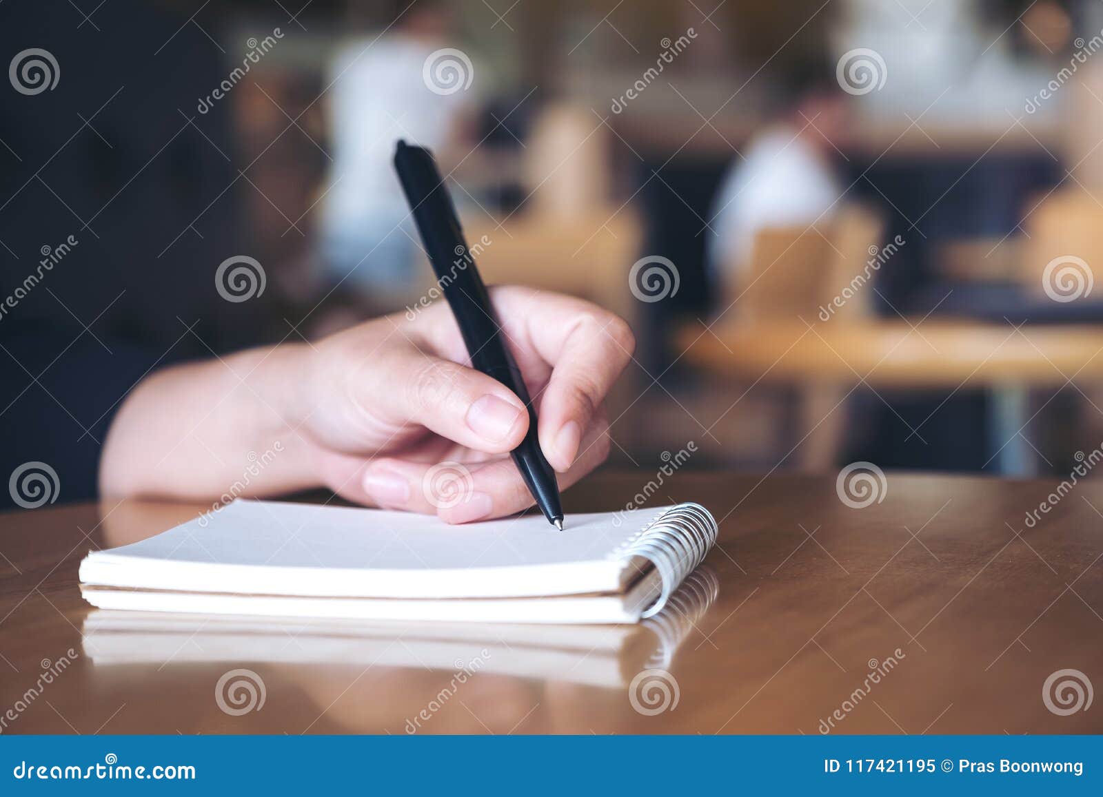 A Hand Writing Down on a White Blank Notebook on Table Stock Image ...